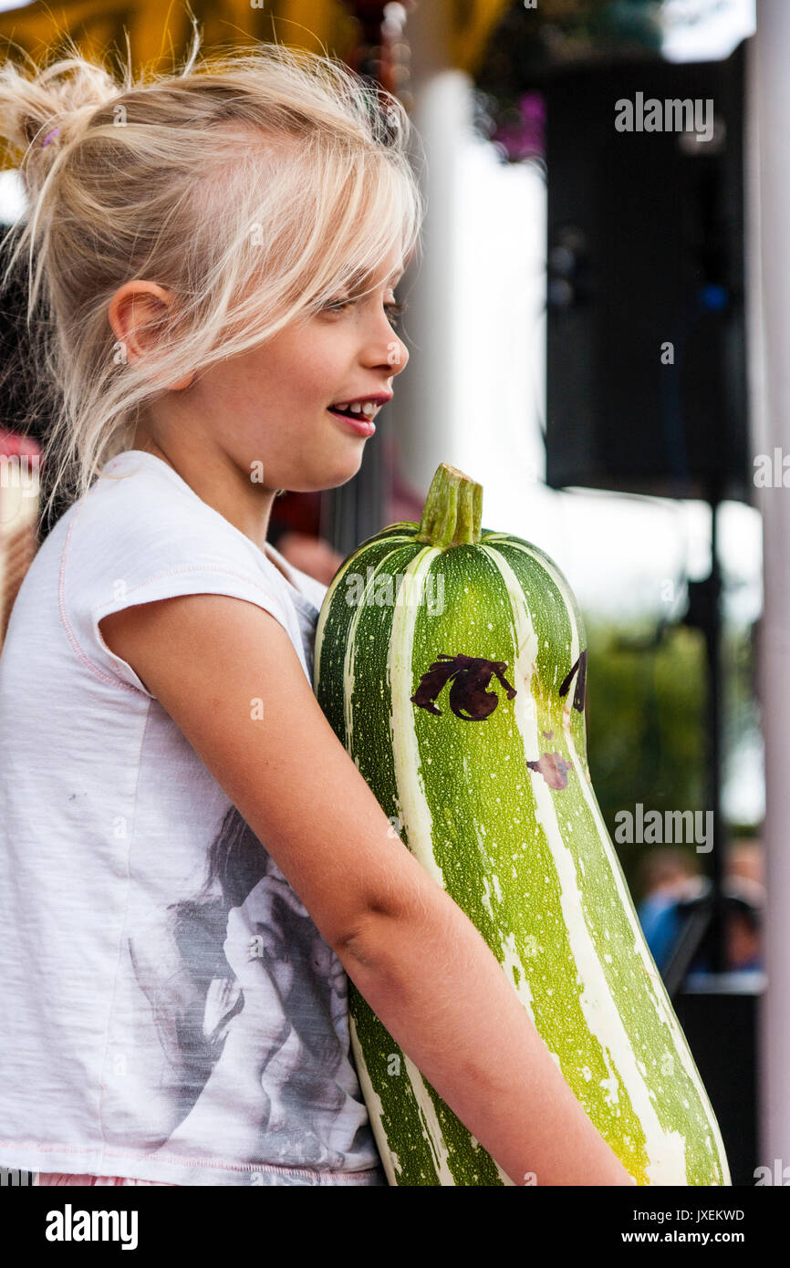 England, Broadstairs folk week. Cute little blonde child, girl, 6-7 ...