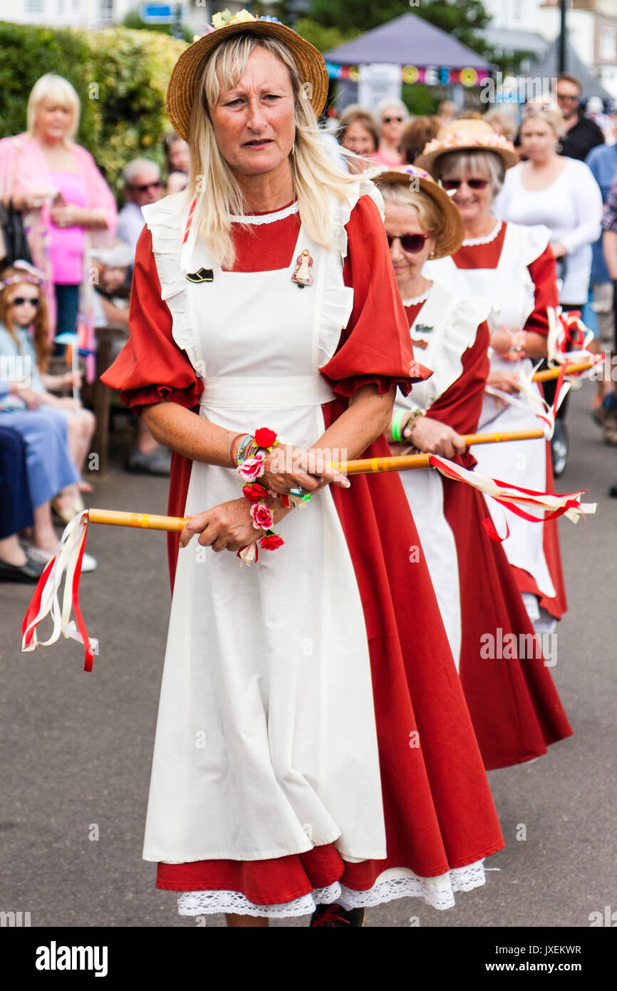 Traditional womens Morris dancers, The Rising Larks. Wearing orange ...
