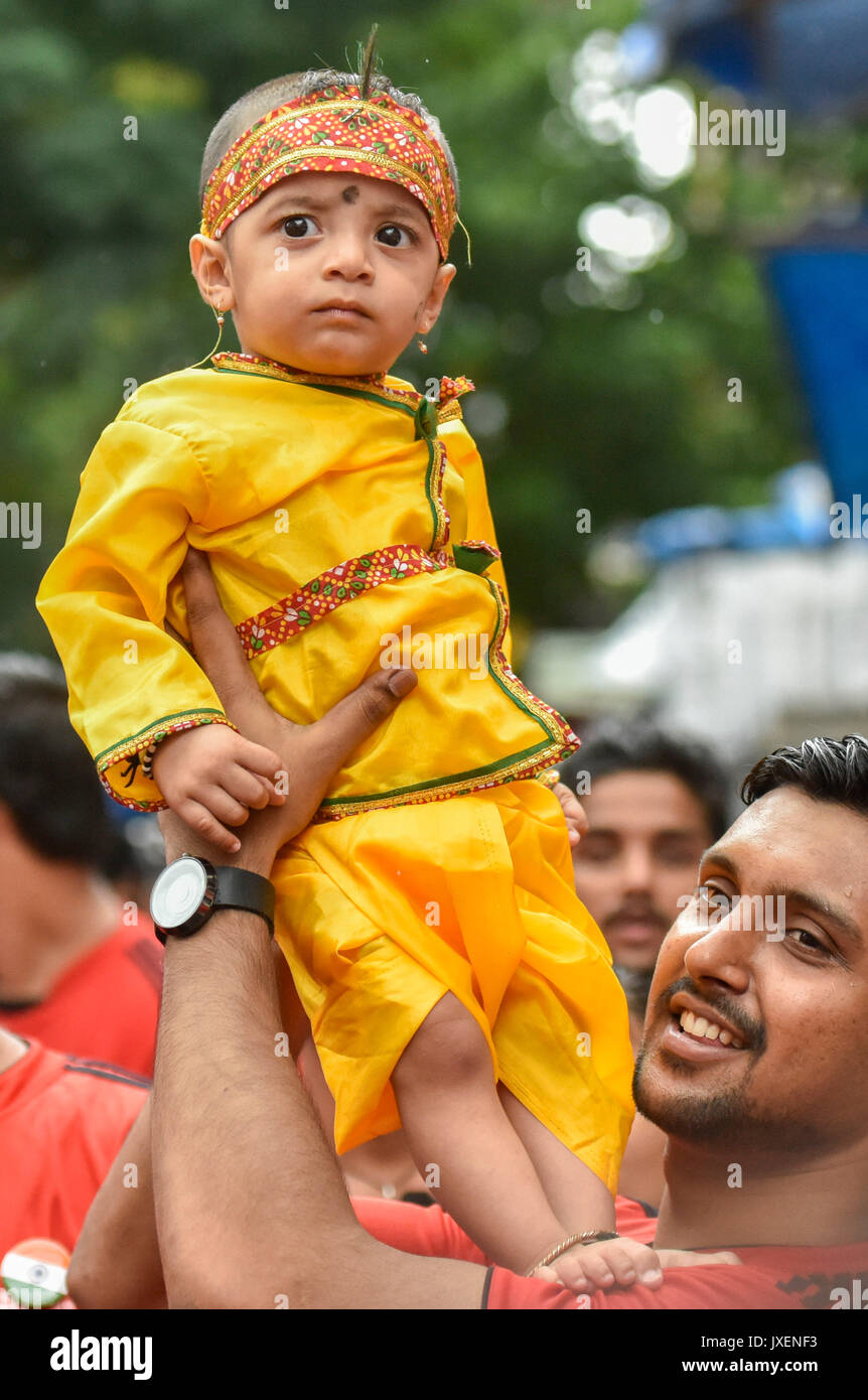 MUMBAI, INDIA - AUGUST 15: Young child dress as lord krishna as Govinda ...