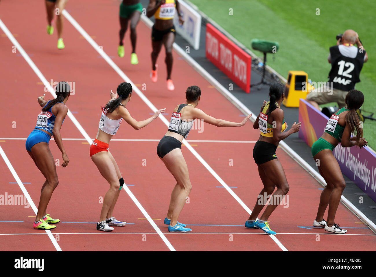 Runners line up to receive the baton in the Women's 4 x 400m Heat 1 at ...