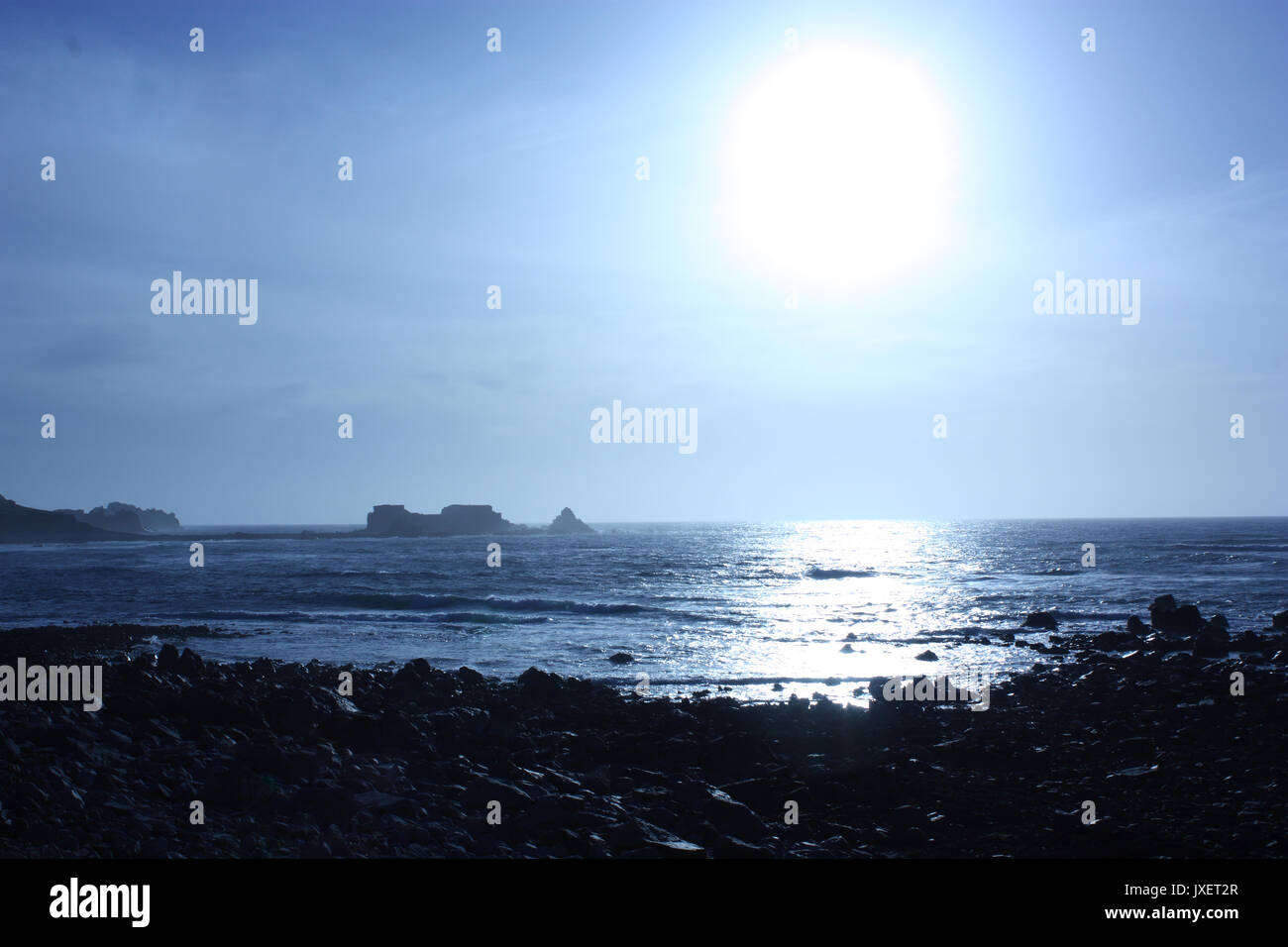 British Channel Islands. Alderney. View of coast and distant Fort ...