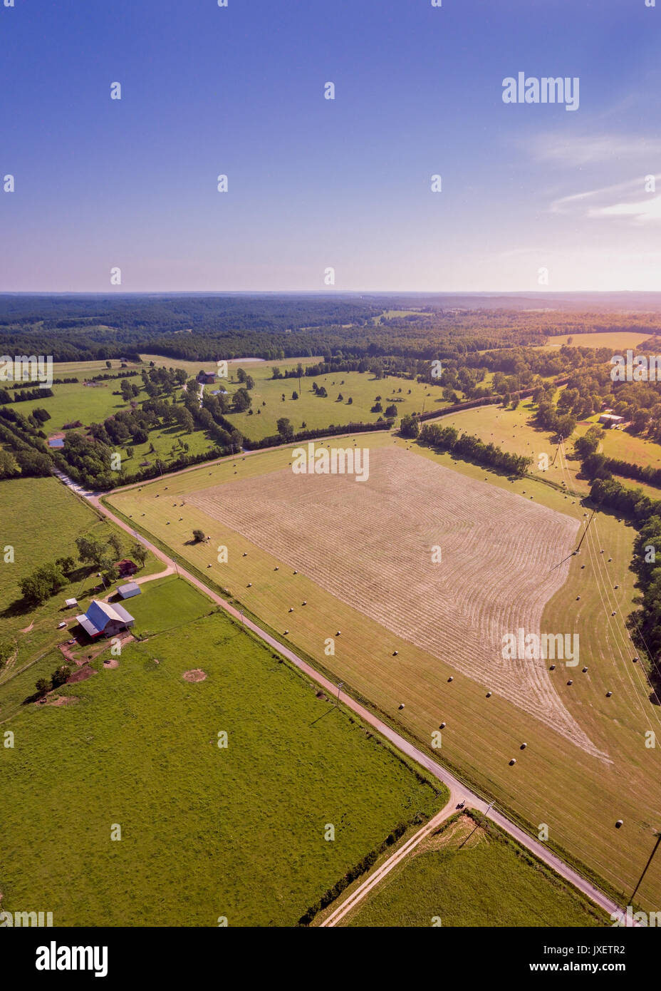 Midwestern farm with cut hay and finished hay bales Stock Photo - Alamy