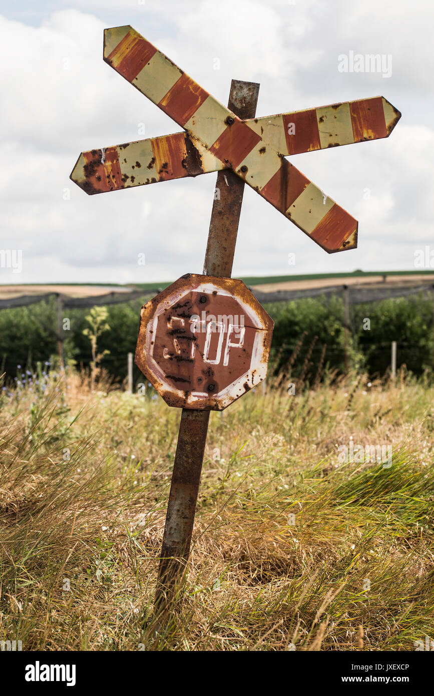Old and rusty railroad sign with stop letters Stock Photo - Alamy