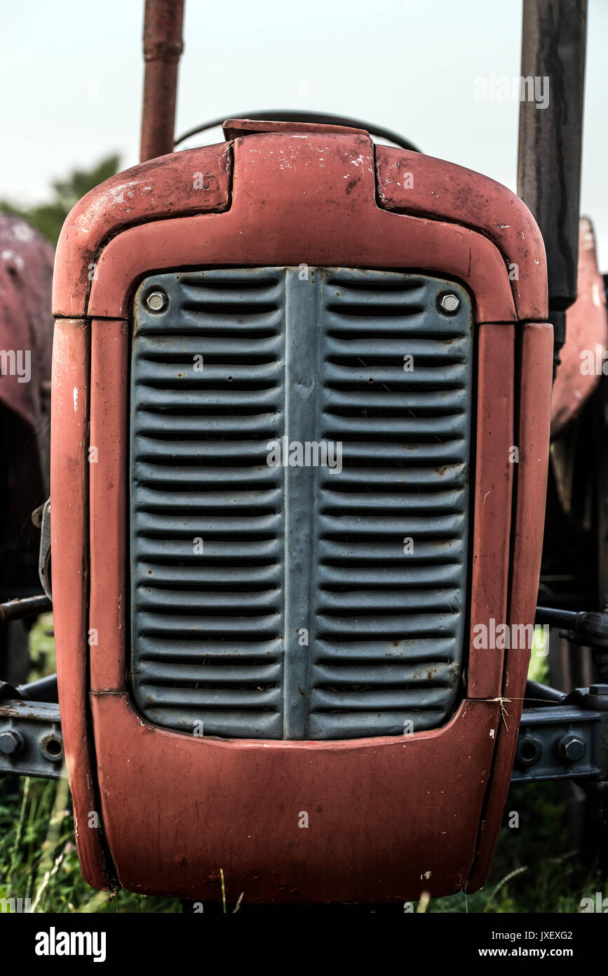 Red old tractor front part metal grill Stock Photo - Alamy