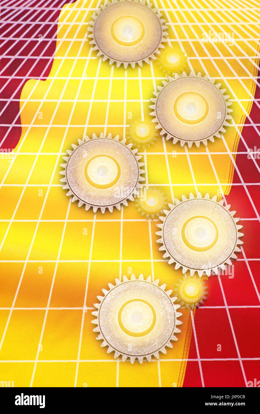 INTERLOCKING COG GEARS ON GRID OVER FLAG OF SPAIN Stock Photo - Alamy