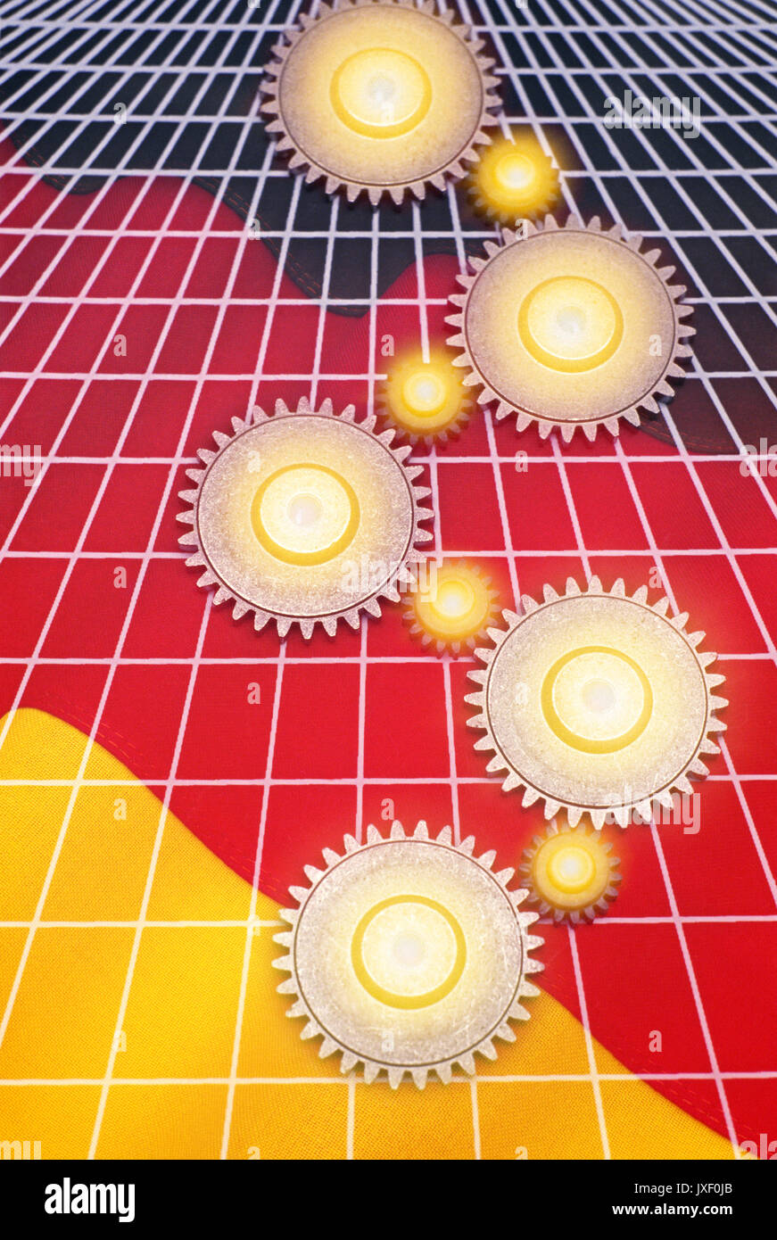 INTERLOCKING COG GEARS ON GRID OVER FLAG OF GERMANY Stock Photo - Alamy