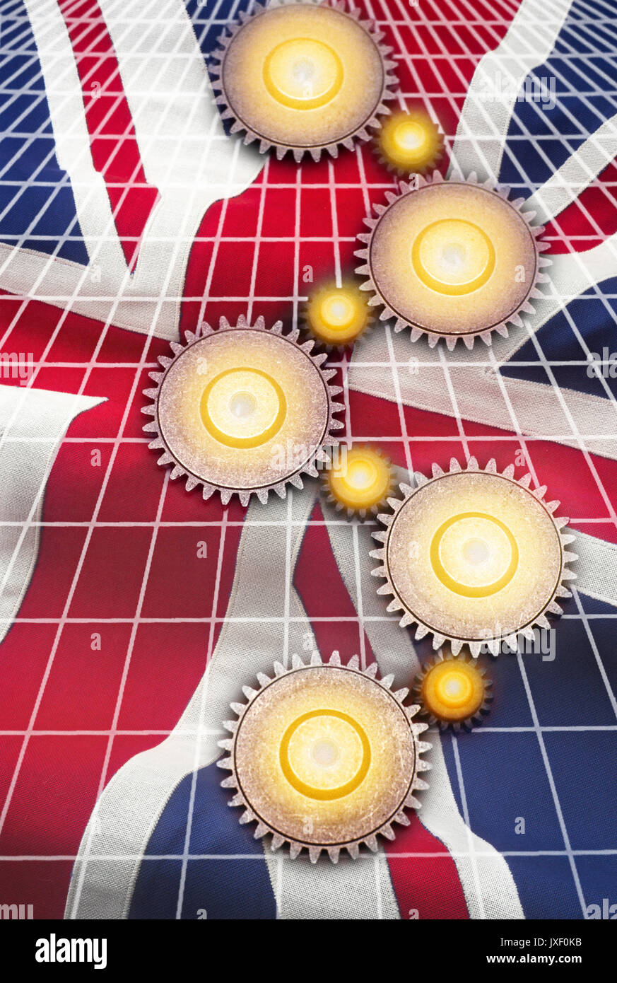 INTERLOCKING COG GEARS ON GRID OVER FLAG OF UNITED KINGDOM Stock Photo ...