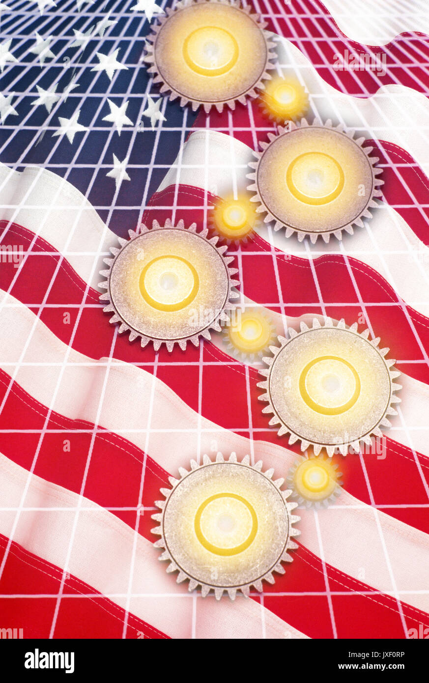 INTERLOCKING COG GEARS ON GRID OVER FLAG OF UNITED STATES OF AMERICA ...