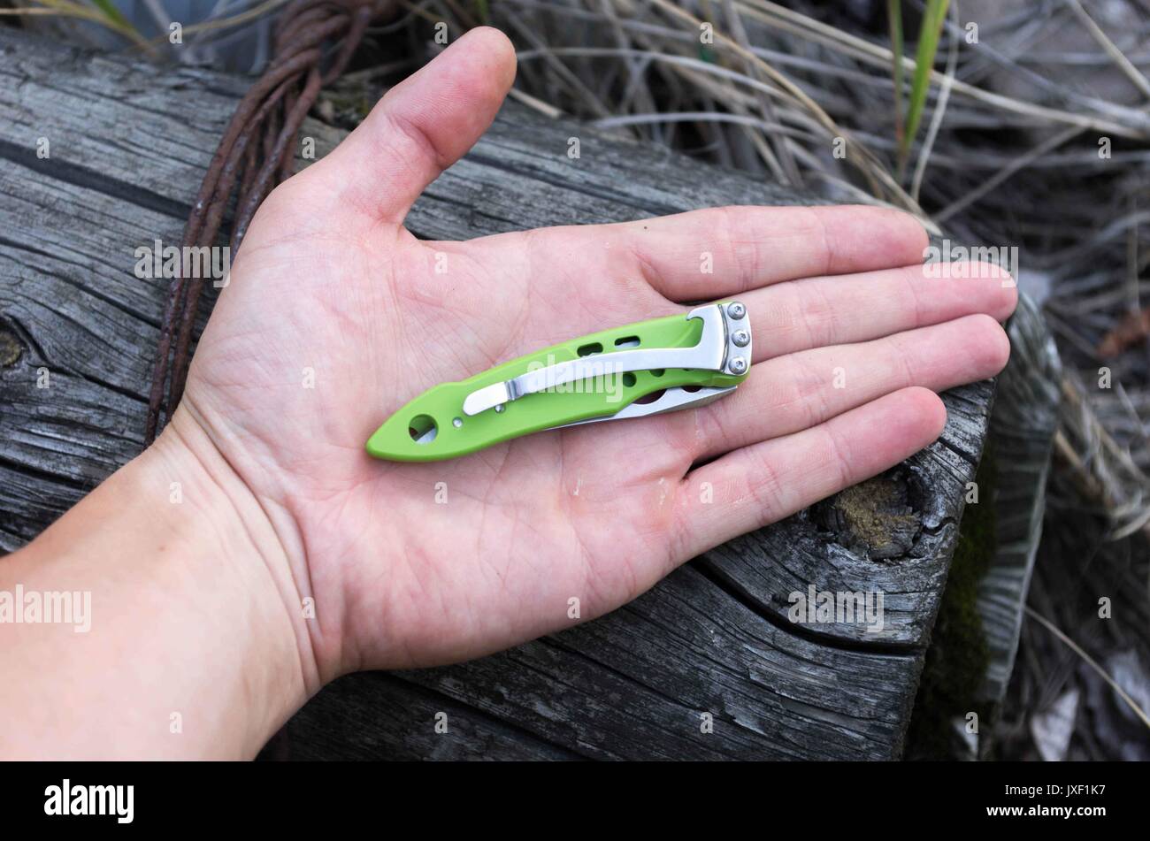 A small knife in the palm of your hand. Tool Stock Photo - Alamy