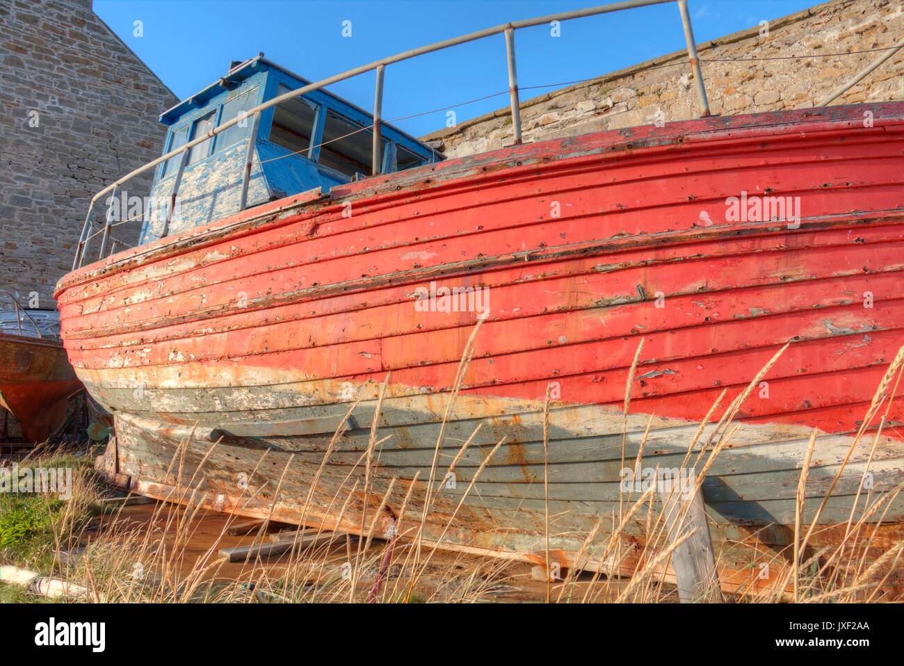 Beached fishing boat Stock Photo - Alamy