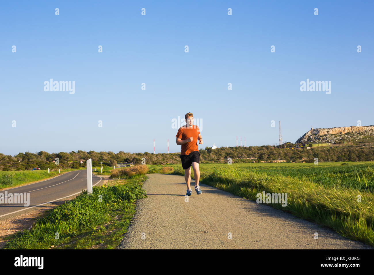 Man running outdoor sprinting for success. Male fitness runner sport ...