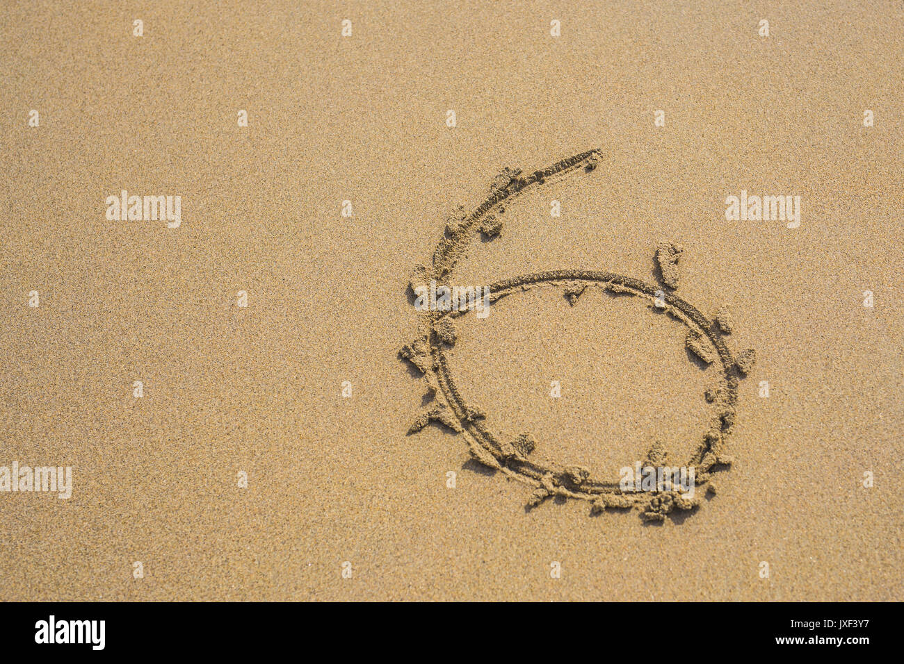 Six number written on sand. Summer beach background Stock Photo - Alamy