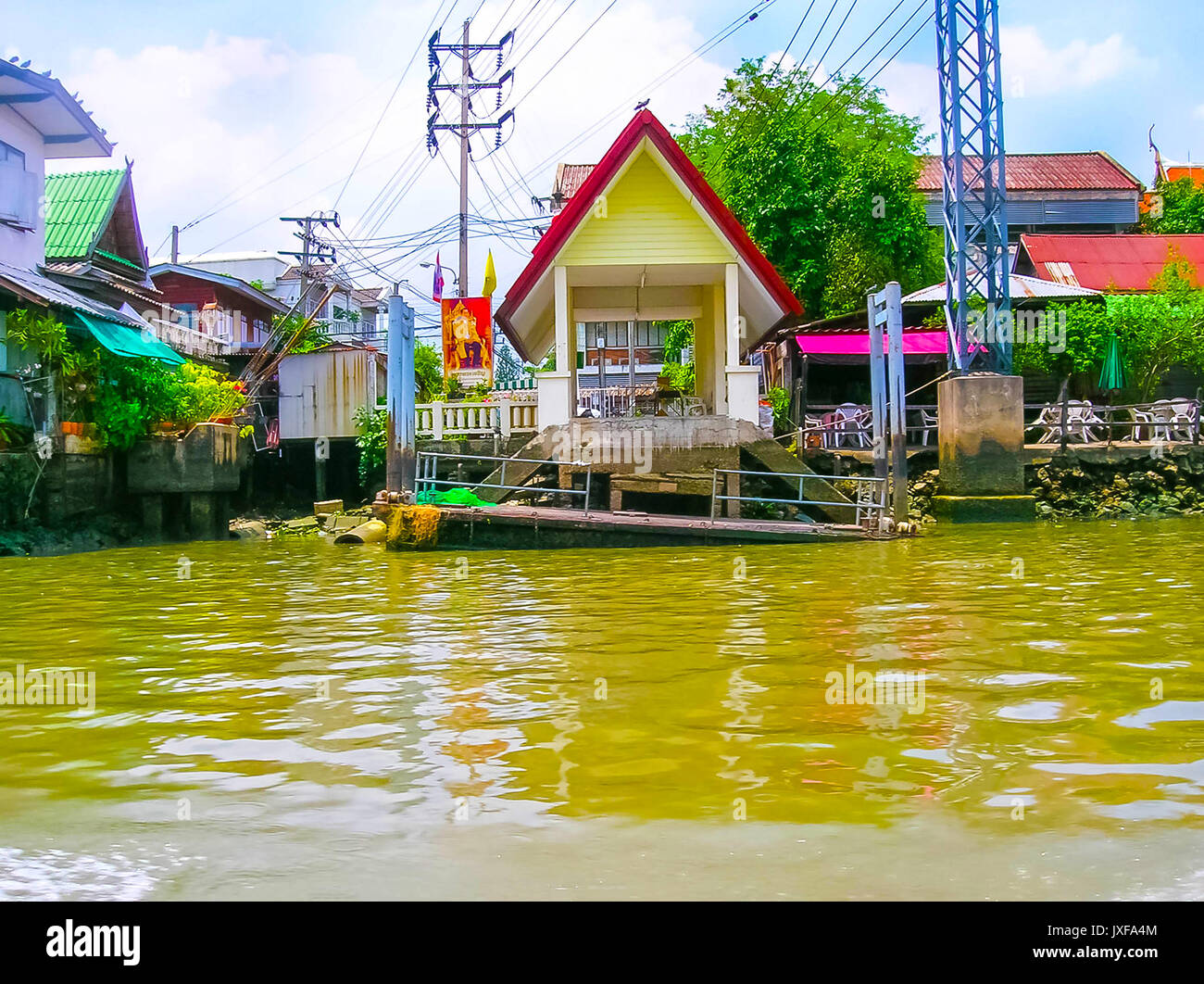 Bangkok, Thailand - June 30, 2008: Wooden slums on stilts the riverside ...