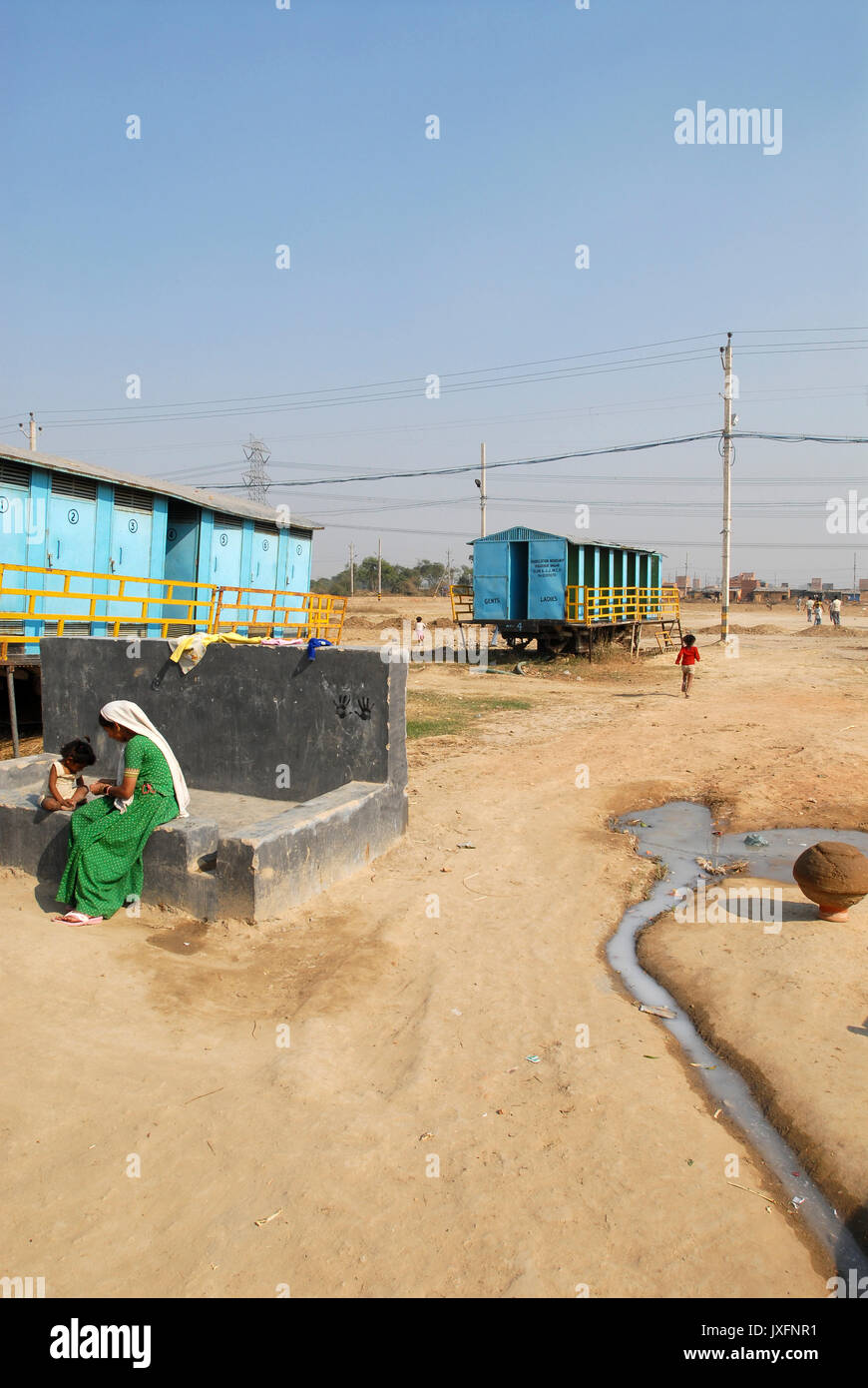 INDIA, New Delhi, forced shifted slum dweller at Slum Naglamachi at ...