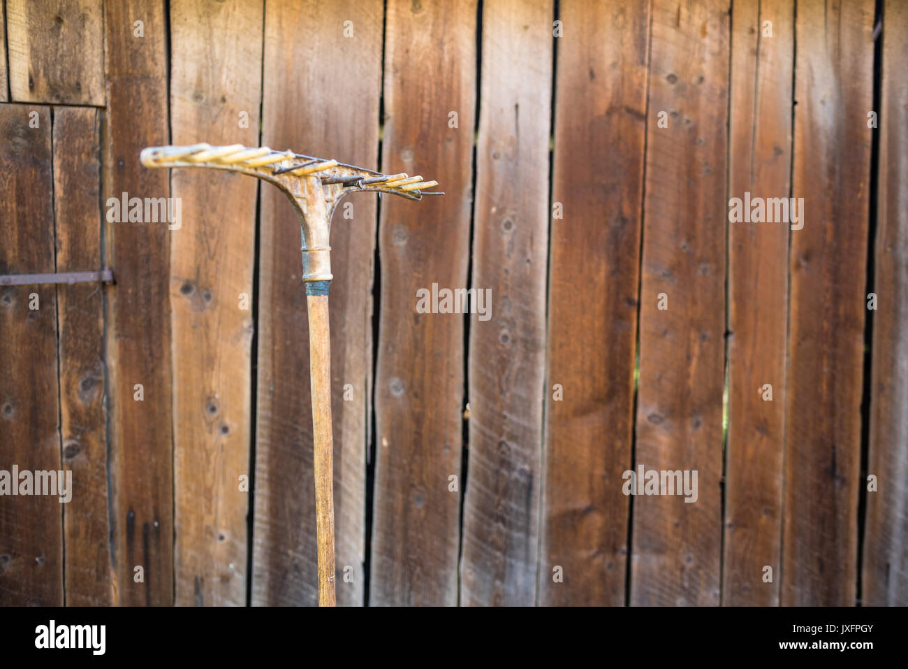 Old rake on the background of the wooden barn, retro, Ukraine Stock ...