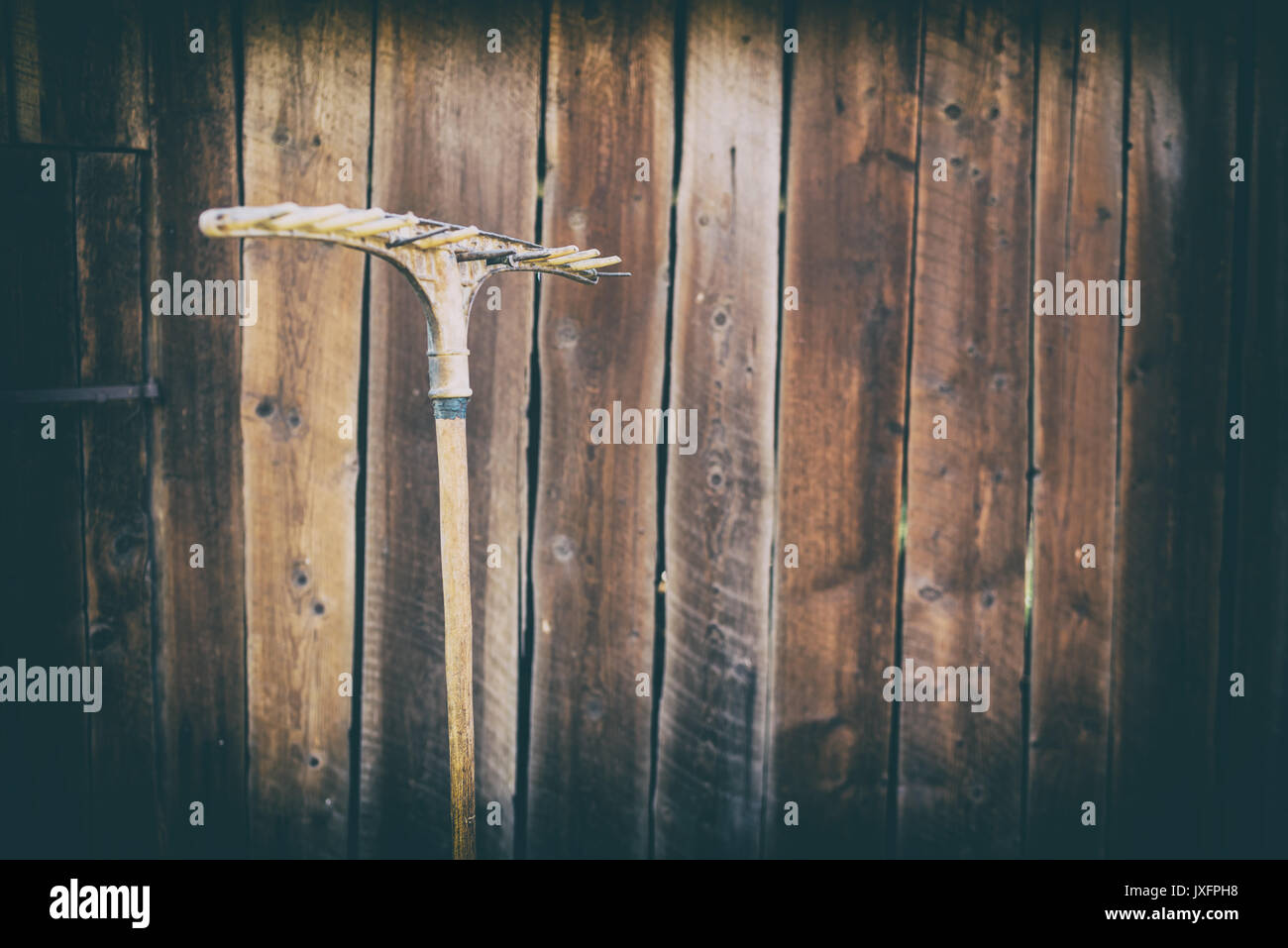 Old rake on the background of the wooden barn, Ukraine Stock Photo - Alamy