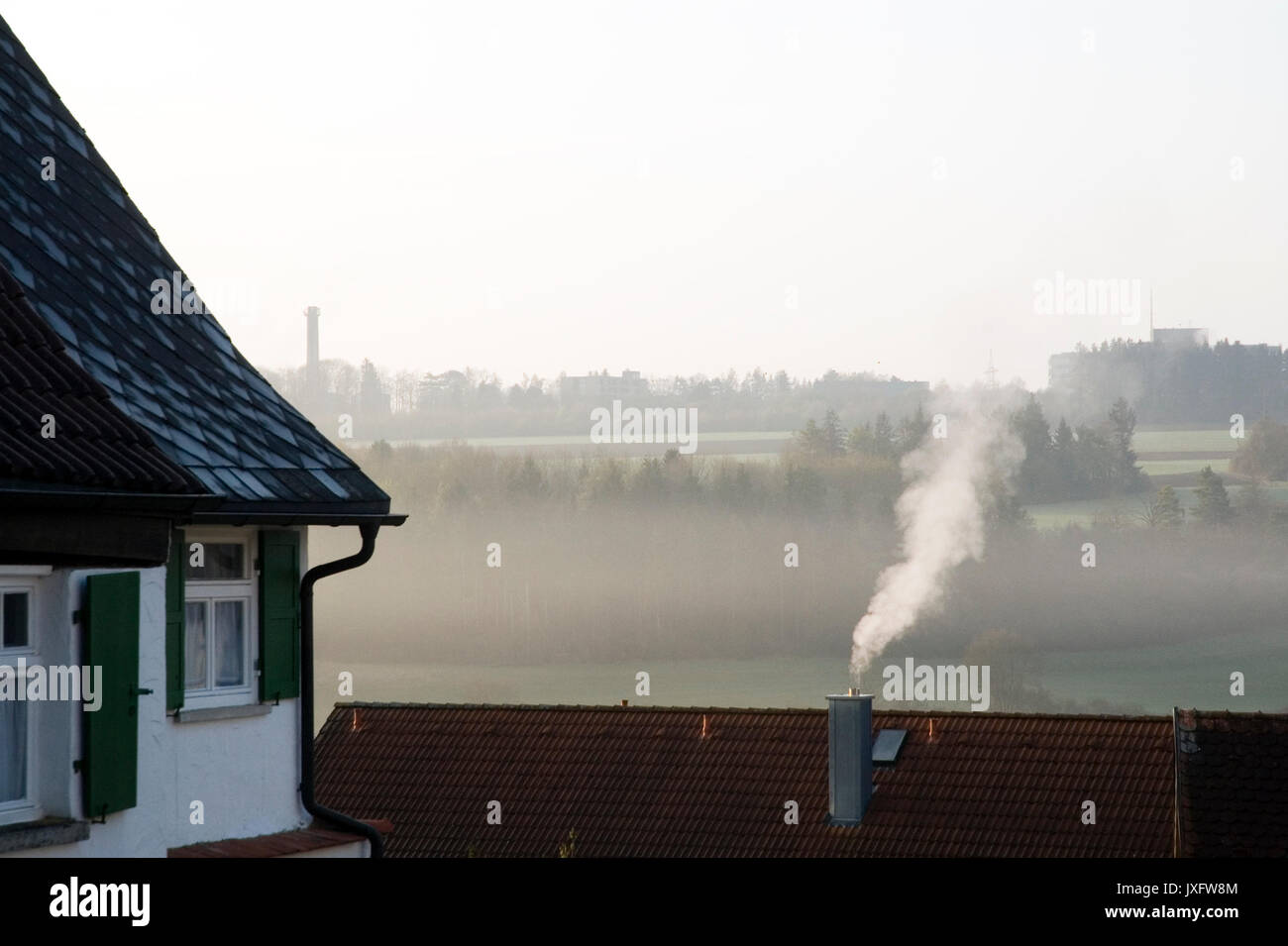 smoking chimney at misty morning Stock Photo - Alamy