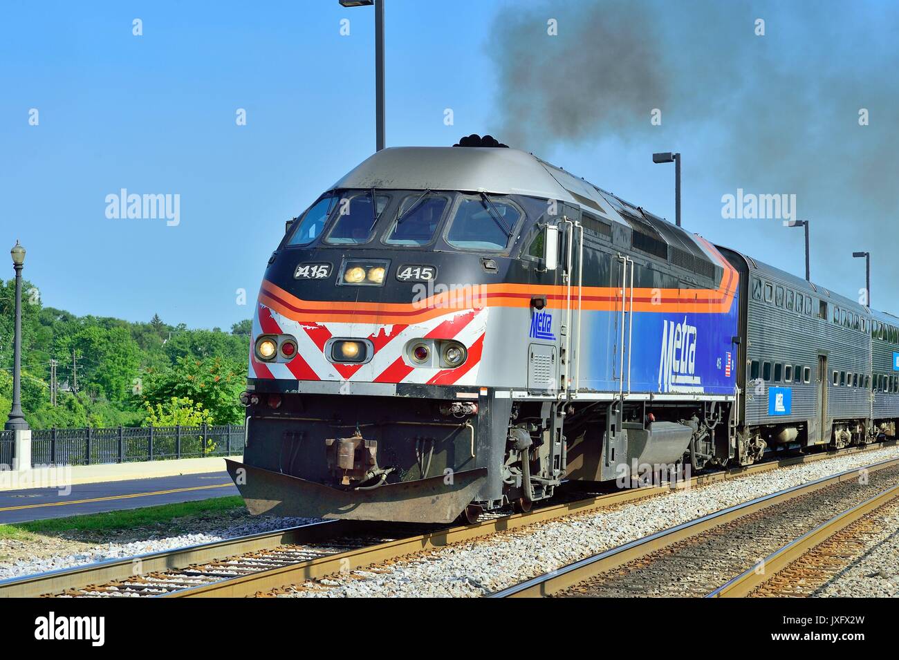 A Metra commuter train leaving the Elgin, Illinois station on its ...