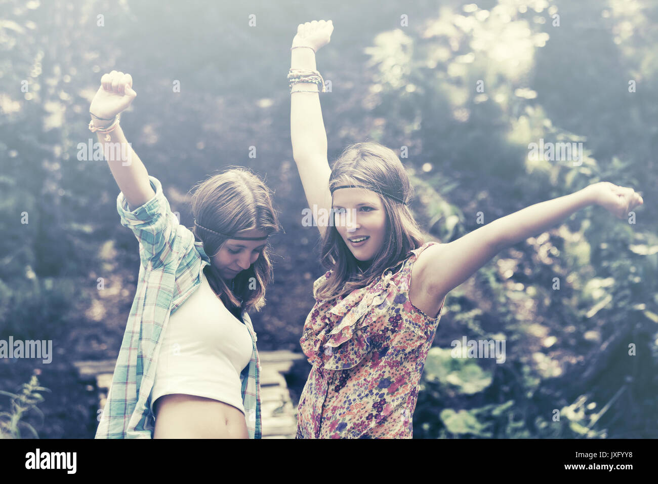 Two happy teen girls in a summer forest Stock Photo - Alamy