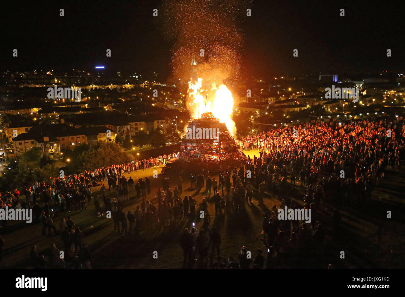 People watch a bonfire in the bogside area of Londonderry, which is ...