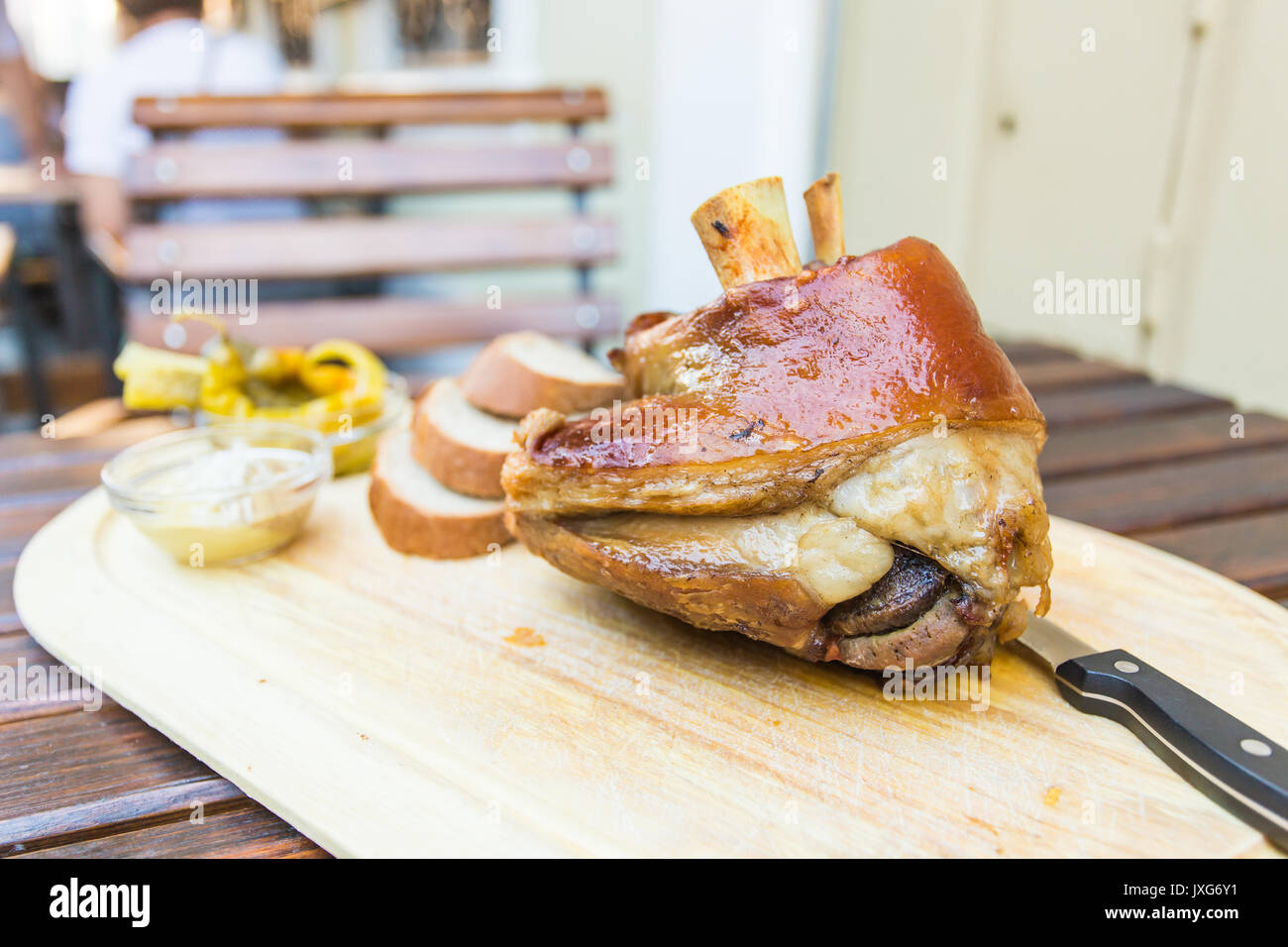 Roasted knuckle of pork on wooden board Stock Photo - Alamy