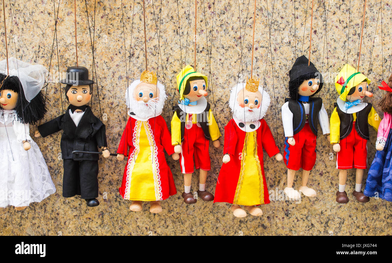 The raw of different puppets in the street Stock Photo - Alamy