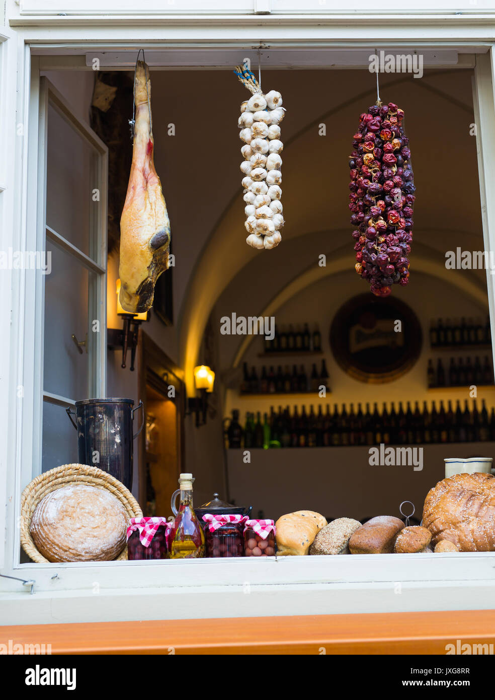 Decorative vegetables and meats hang on the window of restaurant Stock ...