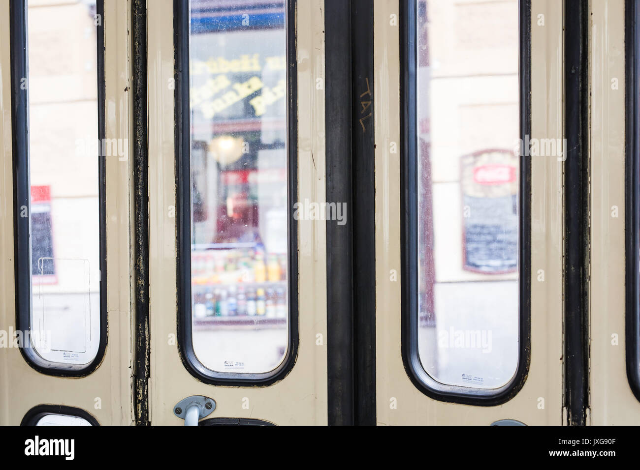 Closed entrance door in tram Stock Photo - Alamy