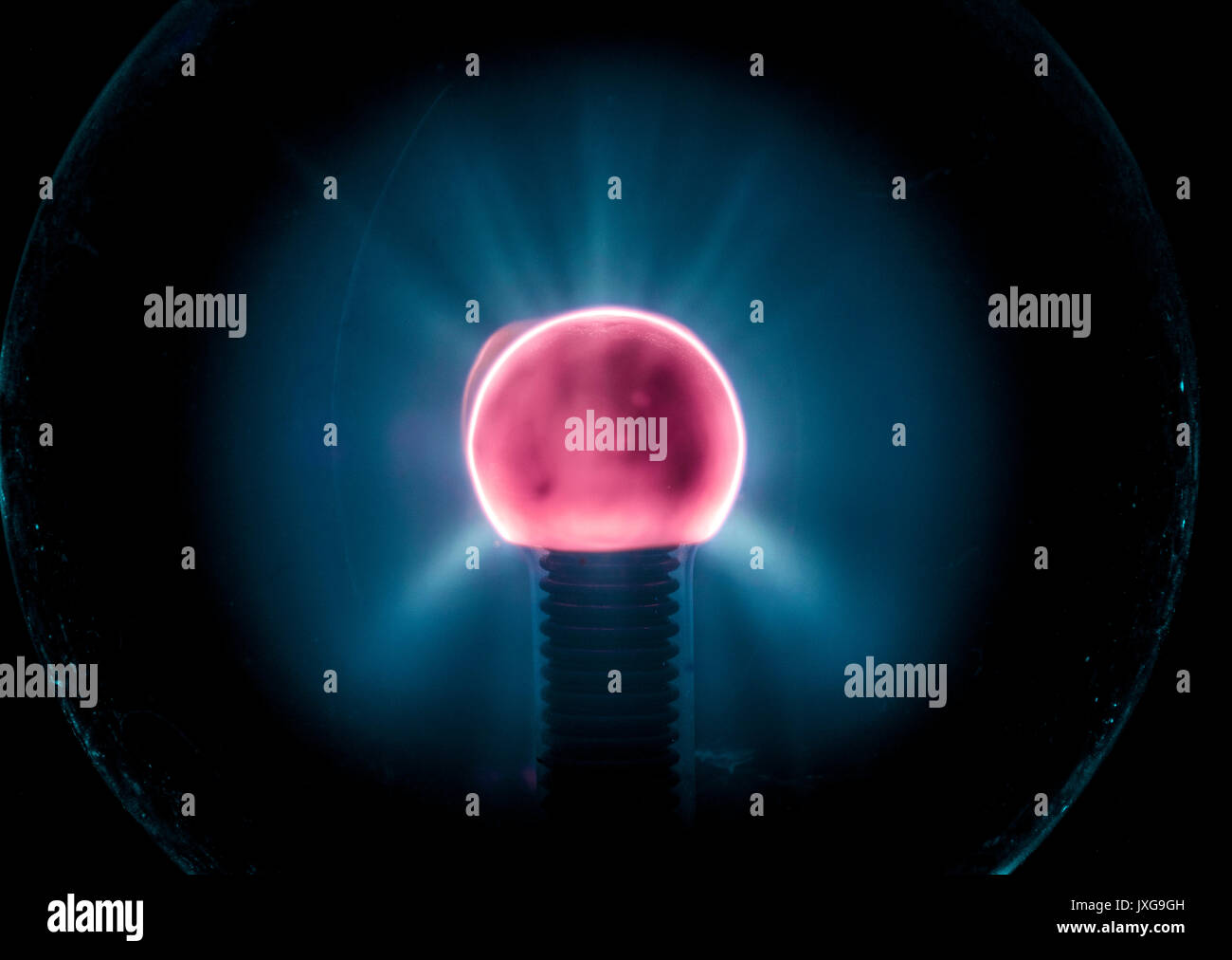 Tesla Coil, lit, on a black background and empty space, long exposure ...