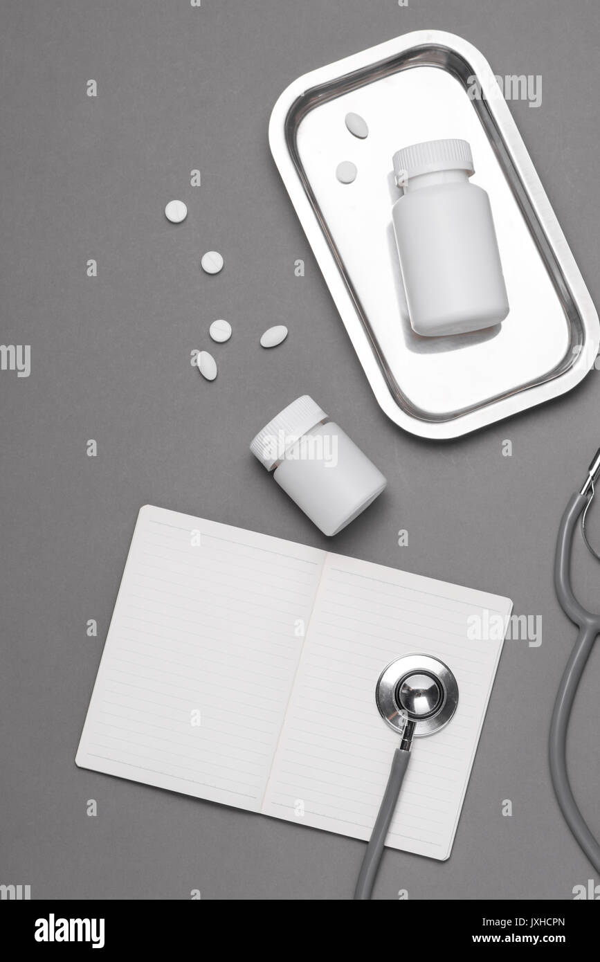 Top view of doctor desk table with stethoscope and medical items. Flat ...