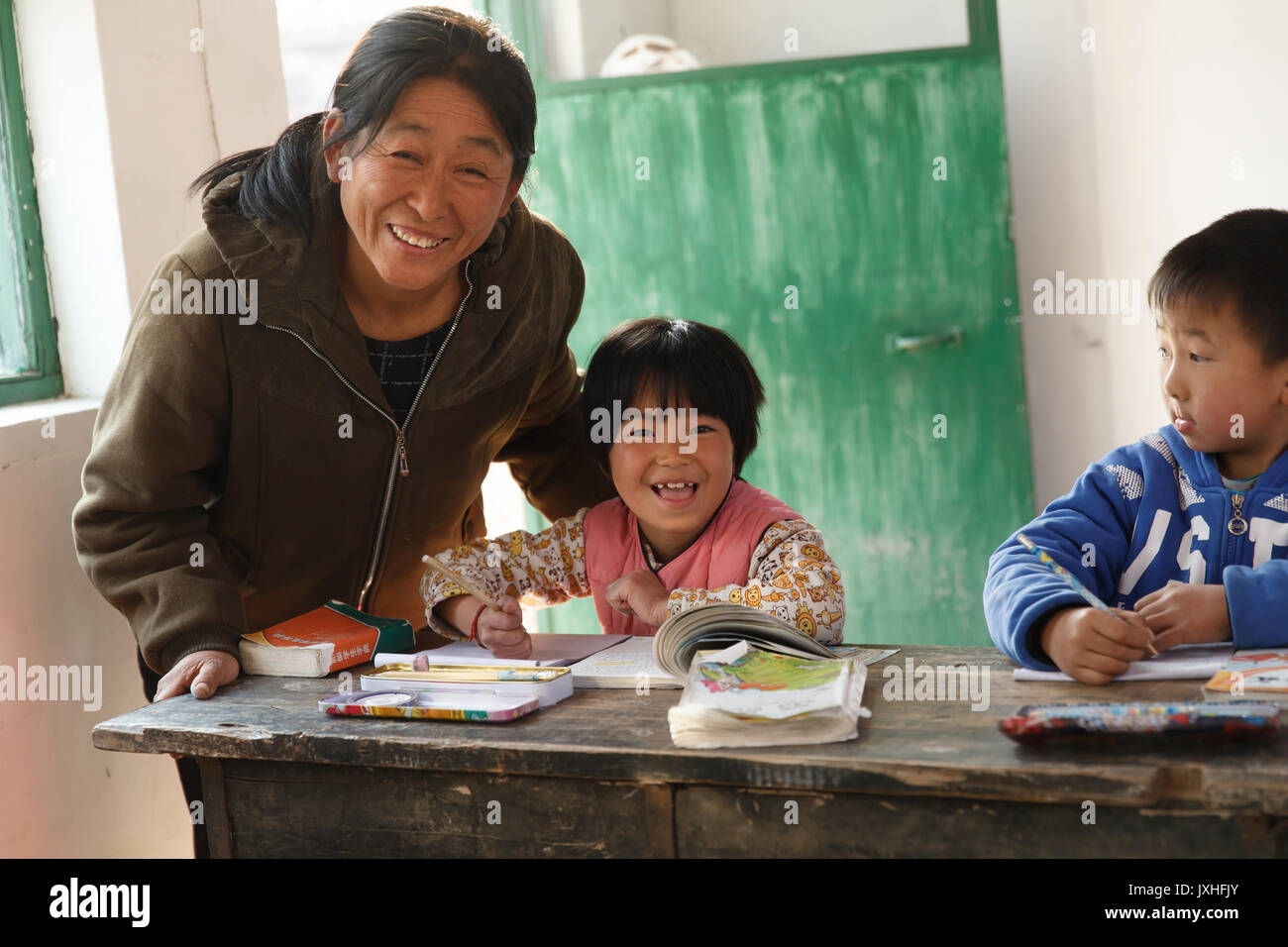 Rural female teachers and pupils in the classroom Stock Photo - Alamy