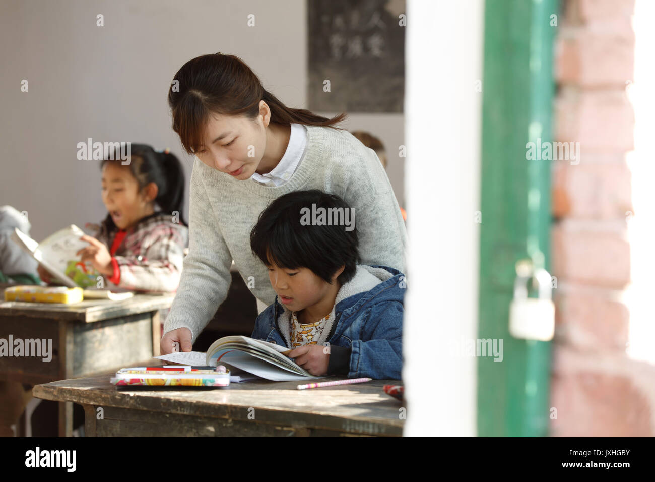 Rural female teachers and pupils in the classroom Stock Photo - Alamy
