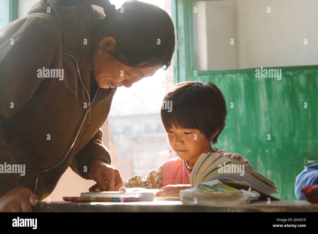 Rural female teachers and pupils in the classroom Stock Photo - Alamy