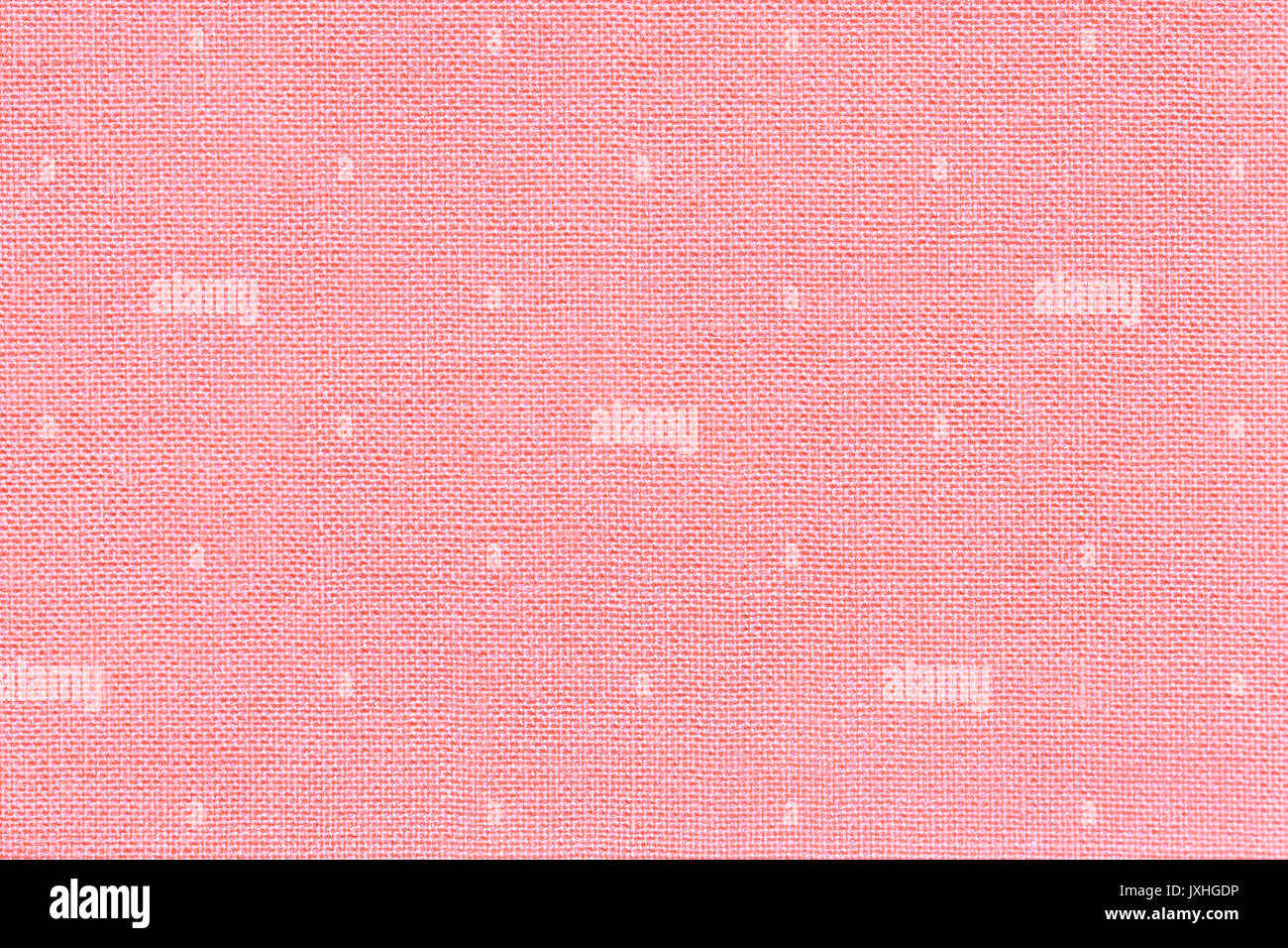 Light pink background from a textile material with wicker pattern ...