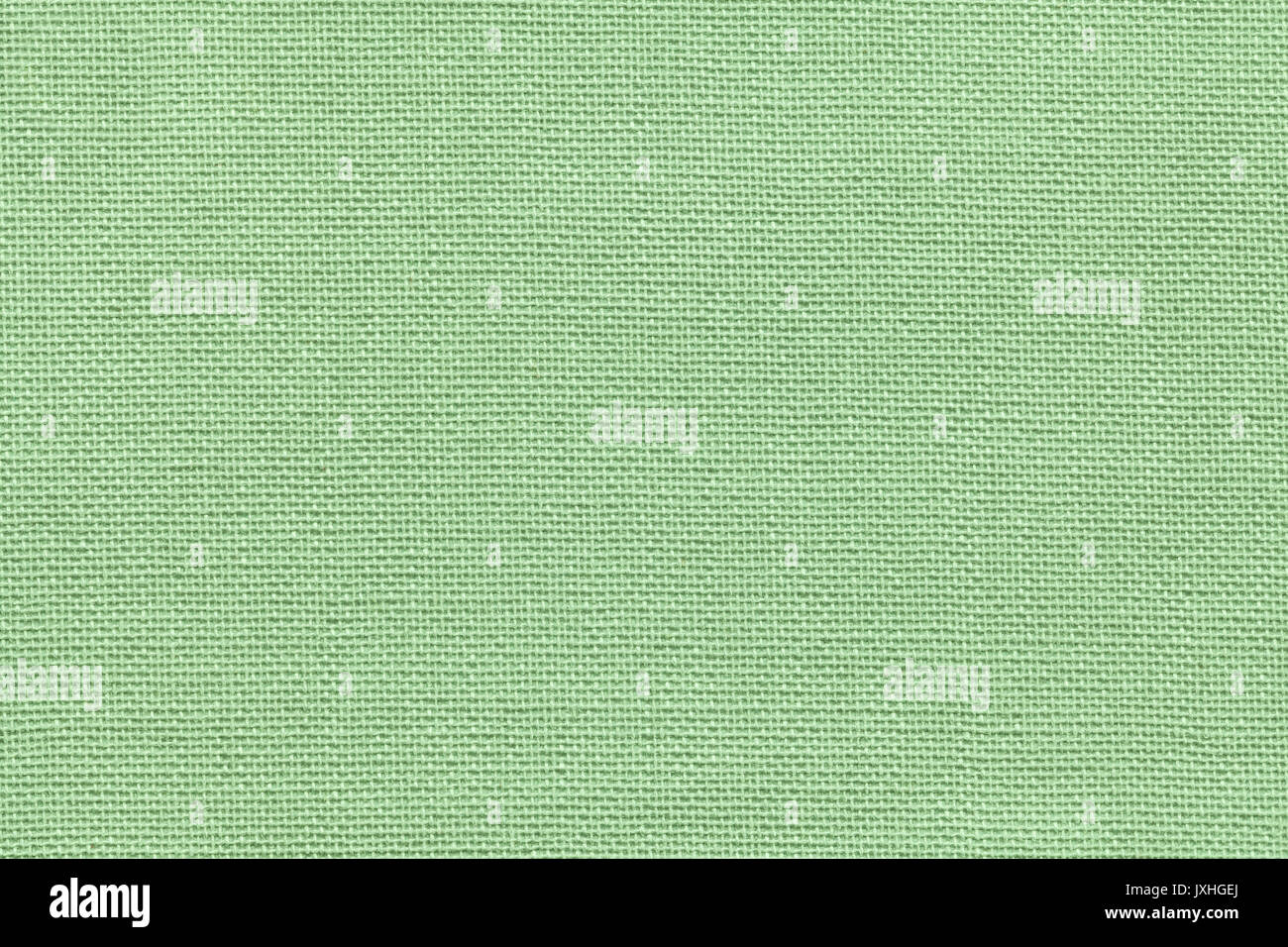 Light green background from a textile material with wicker pattern ...