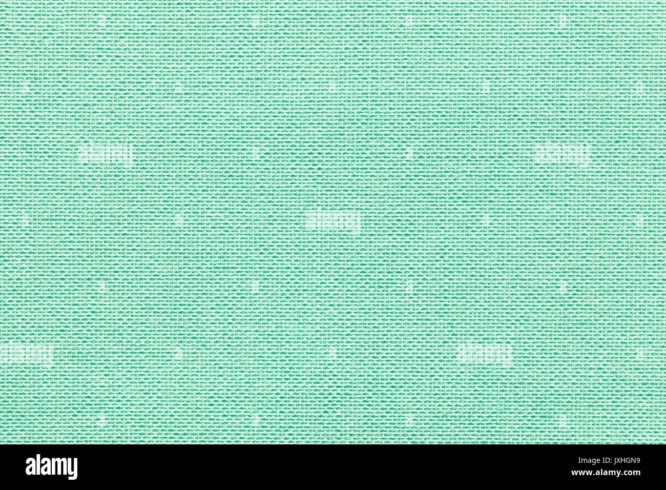 Light green background from a textile material with wicker pattern ...
