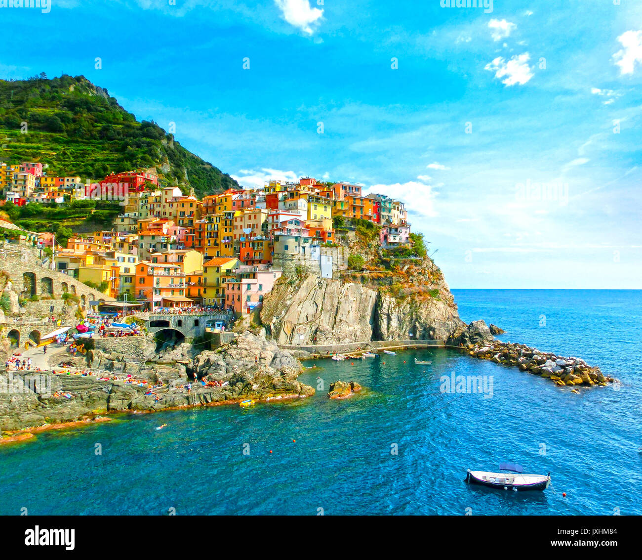 Colorful traditional houses on a rock over Mediterranean sea, Manarola ...