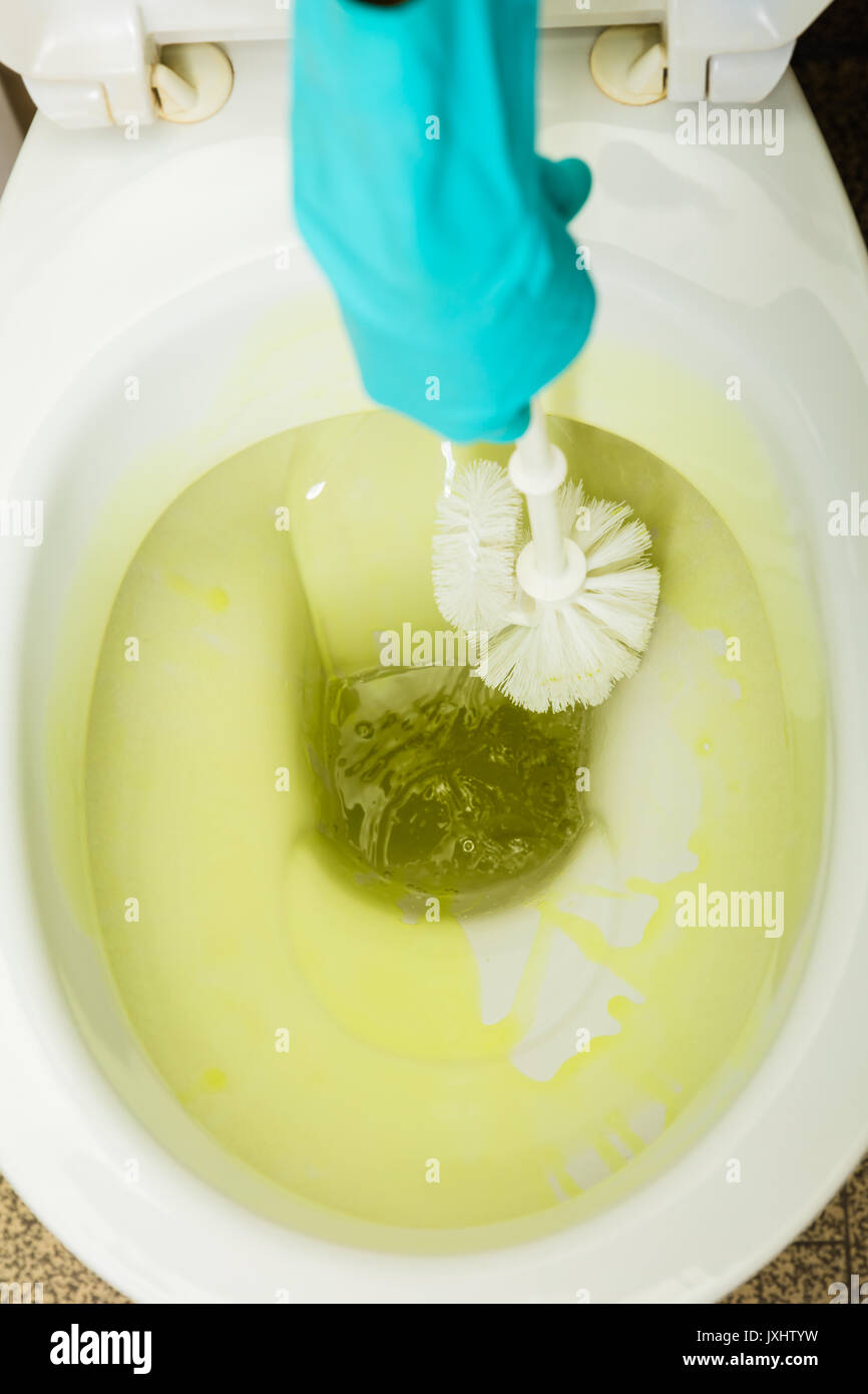 Cleaning toilet bowl using water hi-res stock photography and images ...