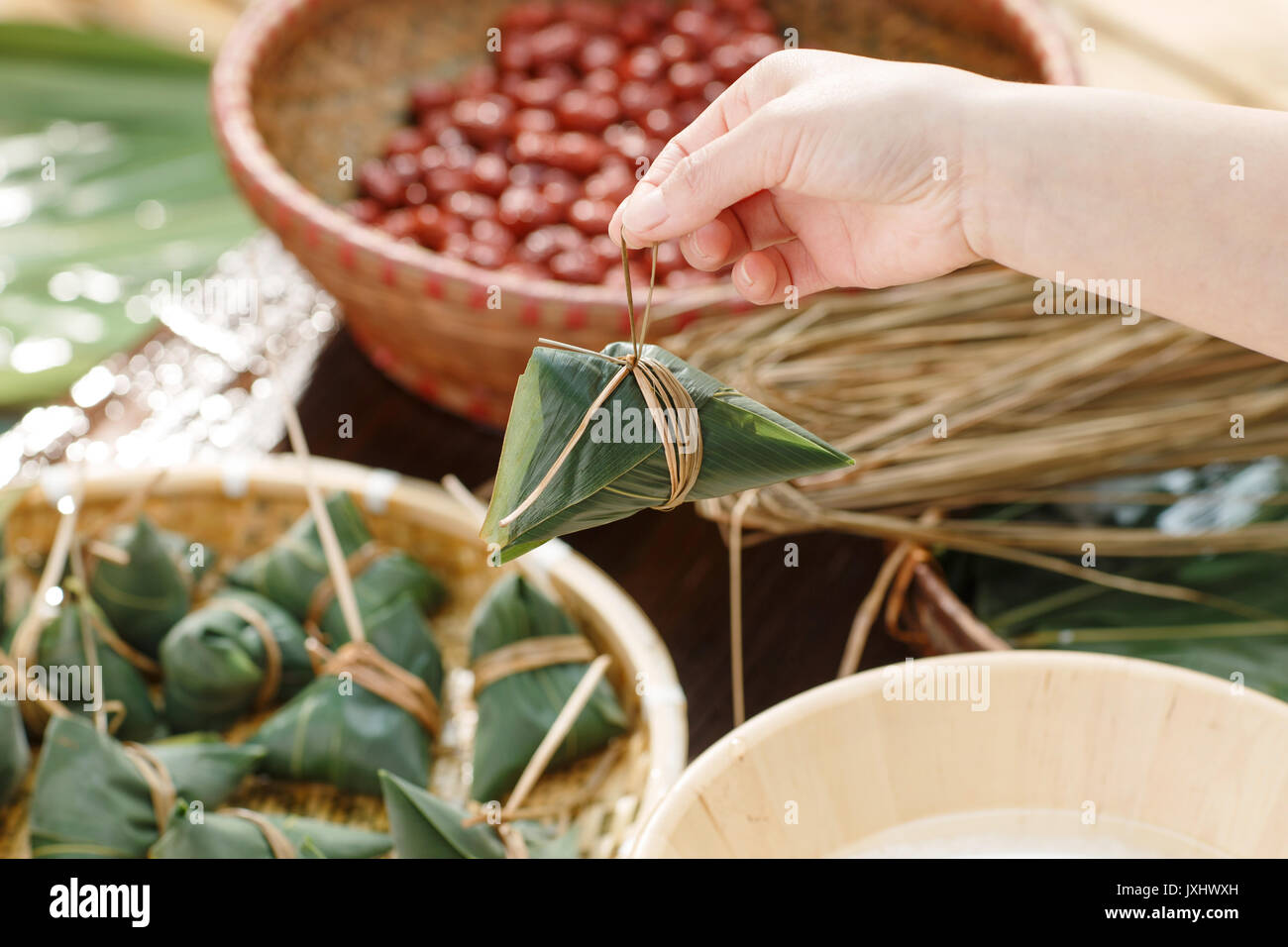 Middle-aged women are making zongzi Stock Photo - Alamy