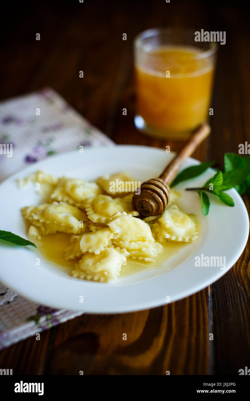 Homemade sweet ravioli with cottage cheese and honey Stock Photo - Alamy