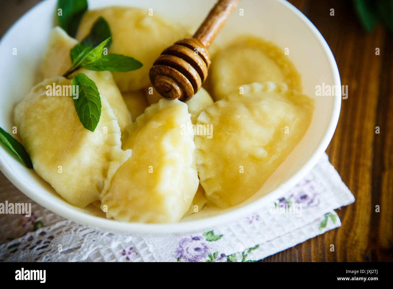 Homemade sweet ravioli with cottage cheese and honey Stock Photo - Alamy