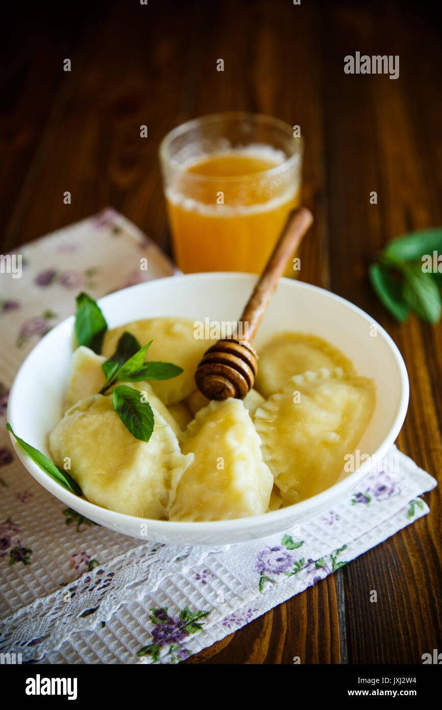 Homemade sweet ravioli with cottage cheese and honey Stock Photo - Alamy