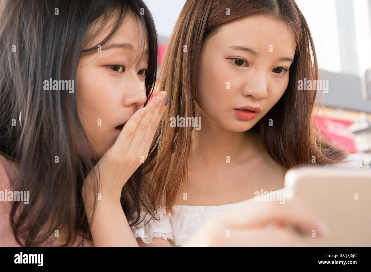 girls watching tablet Stock Photo - Alamy