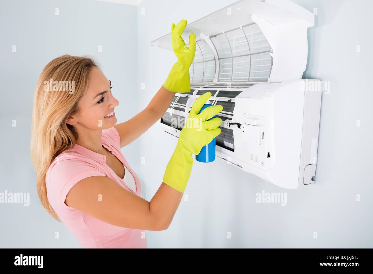 Happy cleaning lady opening hi-res stock photography and images - Alamy