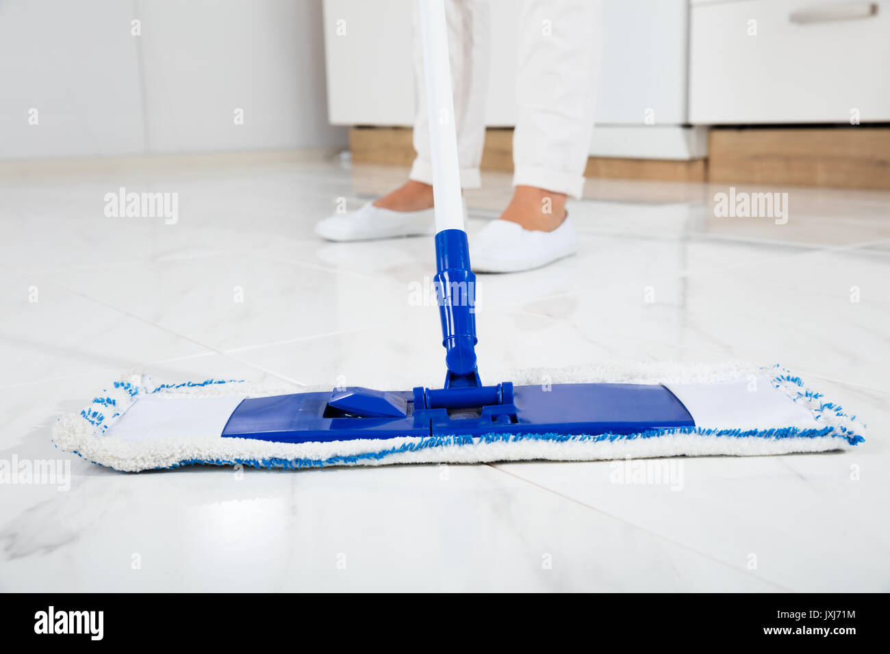 Mopping kitchen floor hi-res stock photography and images - Alamy