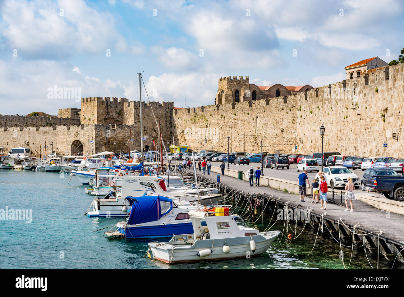 Panoramic view of the fishing harbor and old town walls in Rhodes ...