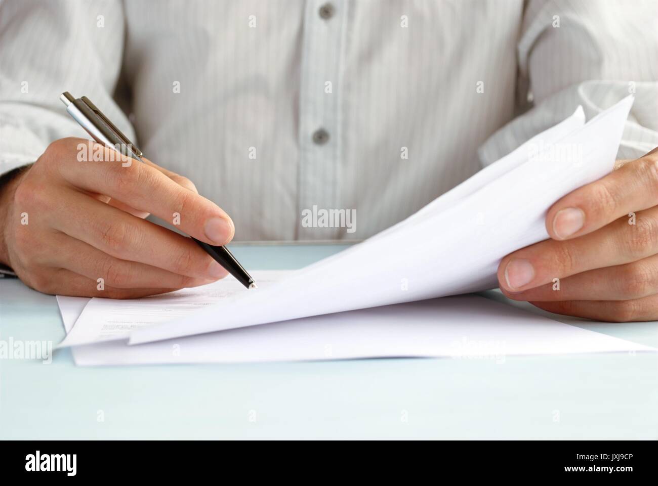 the hand of the man does entries in official papers Stock Photo - Alamy