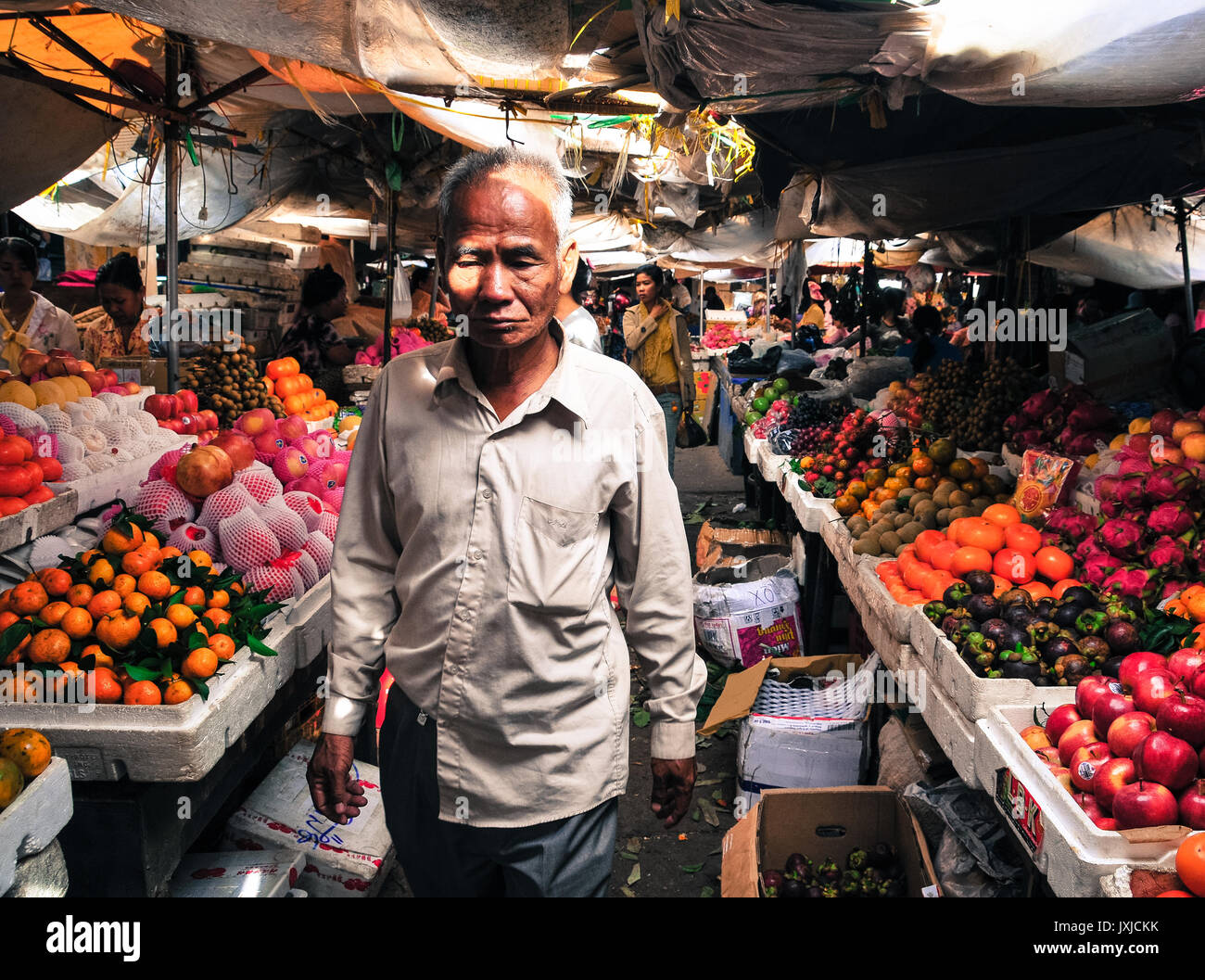 Kampot, Cambodia - Dec 31, 2011. People walking at rural market in ...