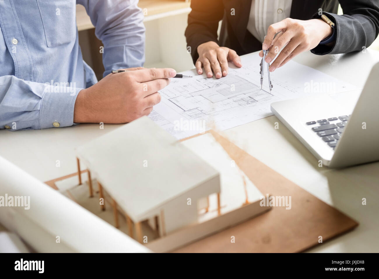 Person's engineer Hand Drawing Plan On Blue Print with architect ...