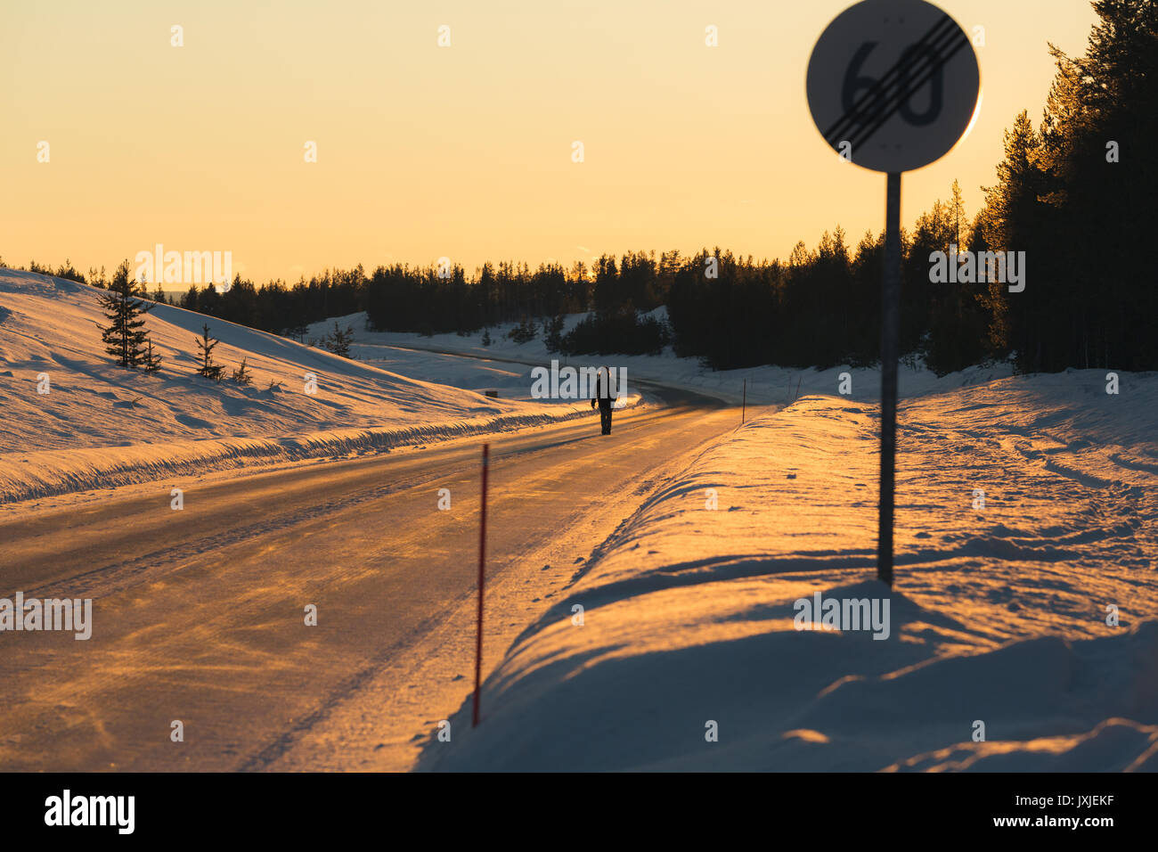 Frozen country with road and snow Stock Photo - Alamy
